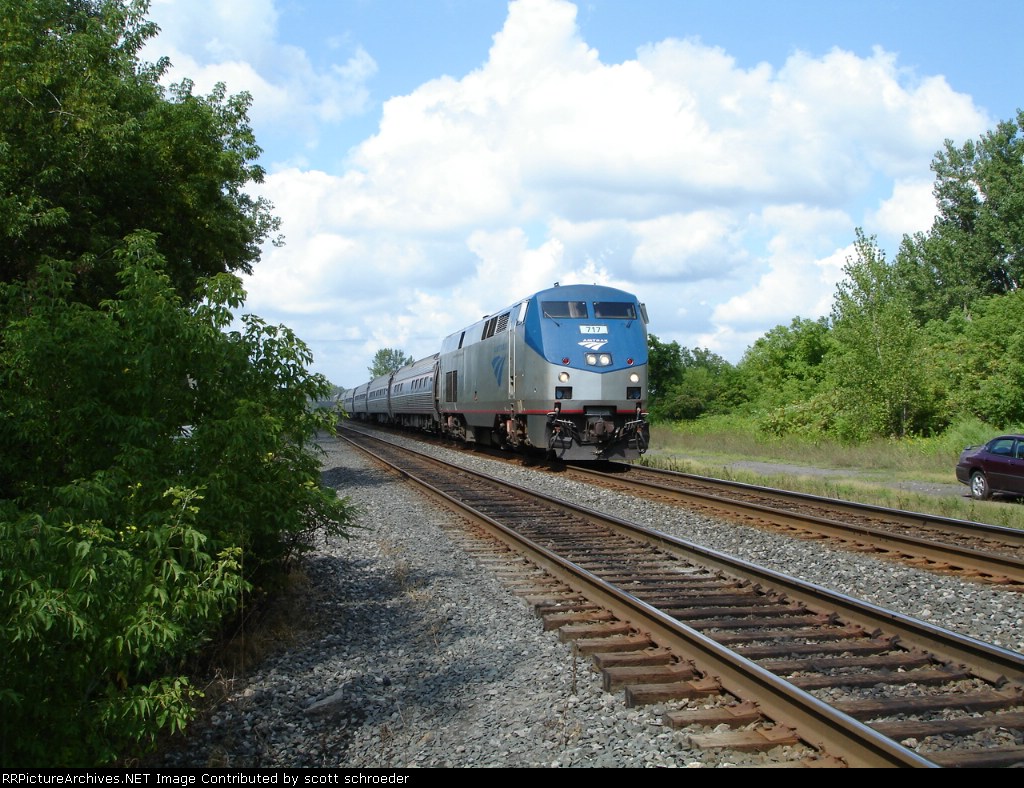 AMTK 717 leading an EB 24-axle passenger train about to get on the Trestle